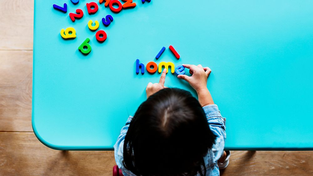 Kid playing with letters desktop | Premium Photo - rawpixel