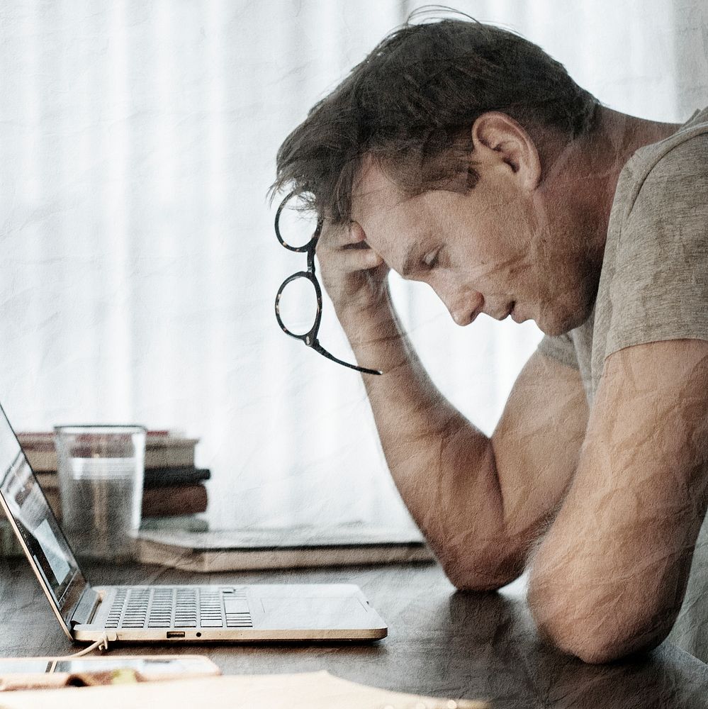 Man feeling stressed out while | Free Photo - rawpixel