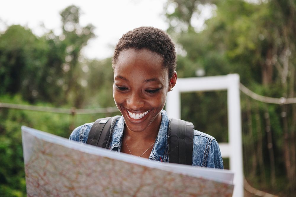 African American woman looking at a map | Premium Photo - rawpixel