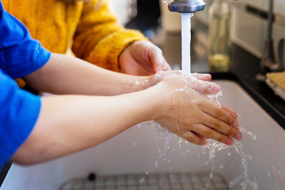 Boy washing his hands to lessen | Free Photo - rawpixel