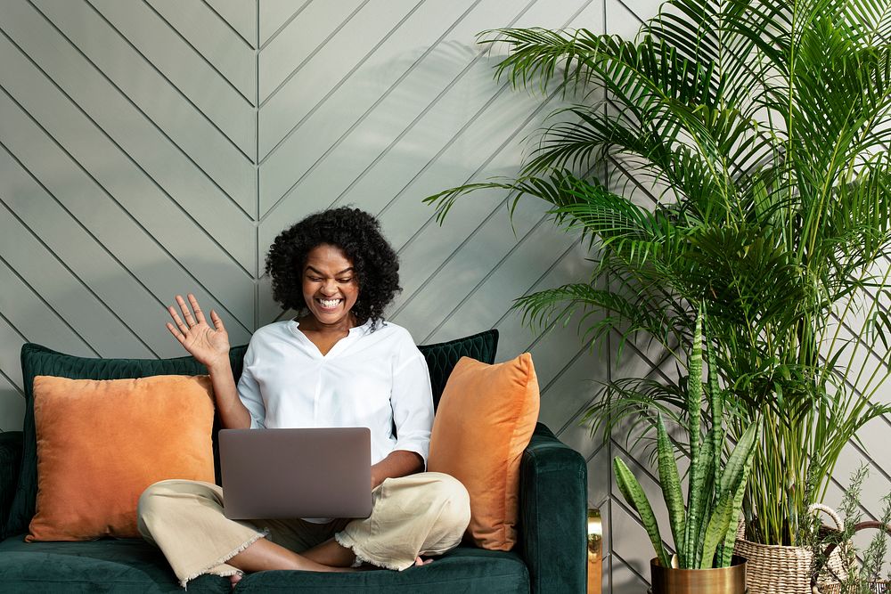 Smiling woman during conference call | Premium Photo - rawpixel
