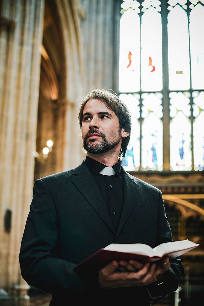 Christian priest standing by the altar | Premium Photo - rawpixel