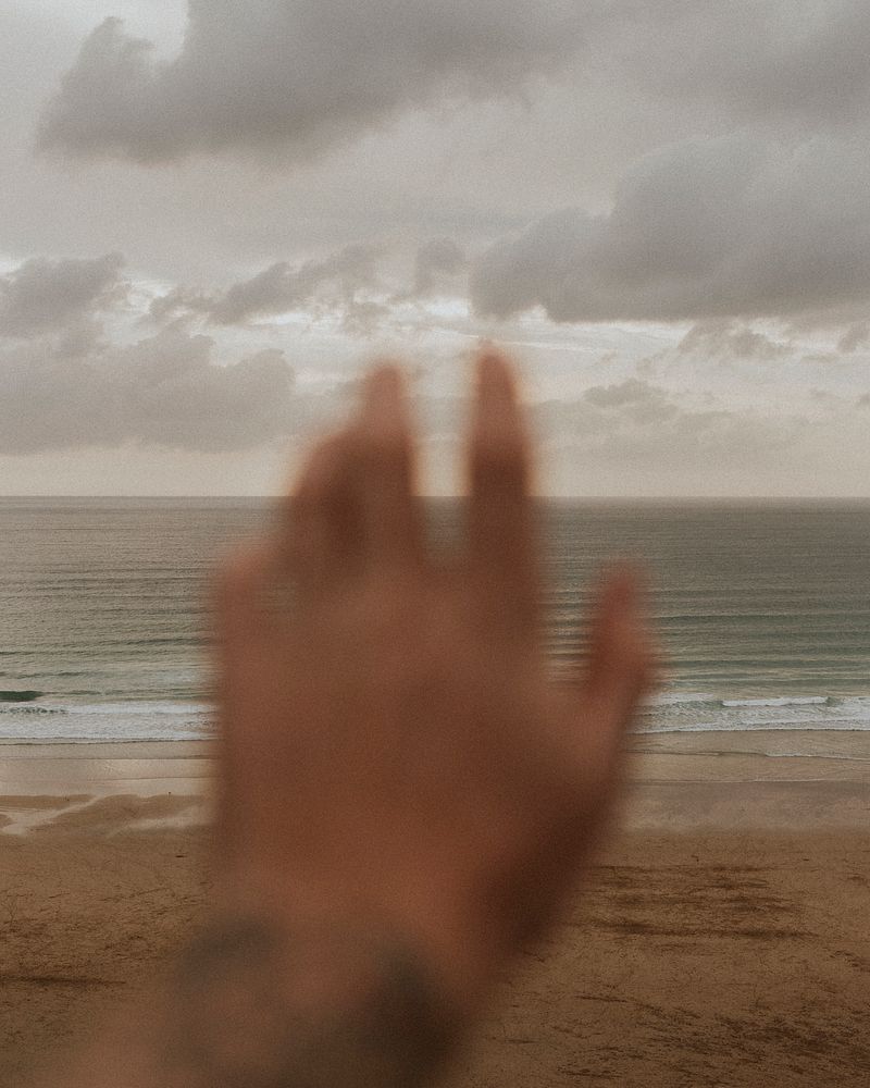Hand over the calm ocean | Premium Photo - rawpixel