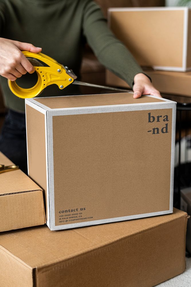 Parcel box psd being packed | Free PSD Mockup - rawpixel