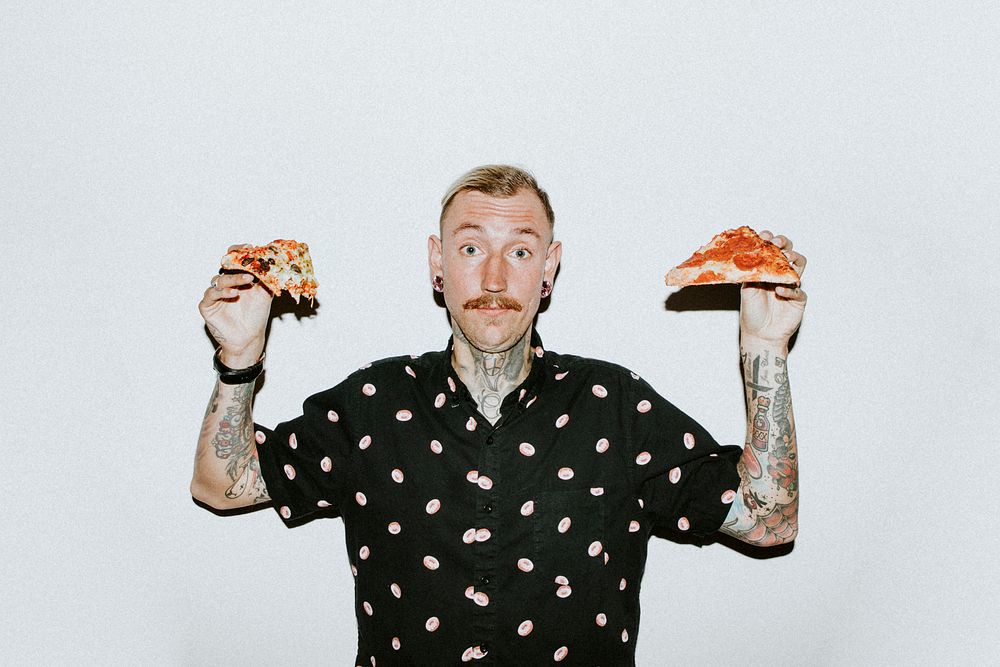 A man having a pepperoni | Premium Photo - rawpixel