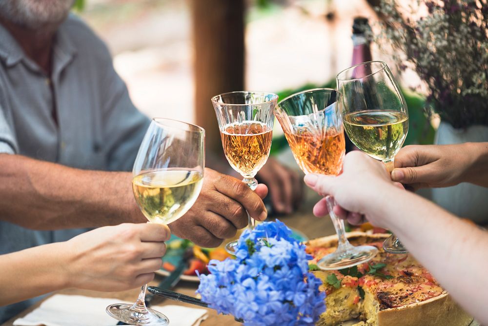 Happy people cheering with wine | Photo - rawpixel