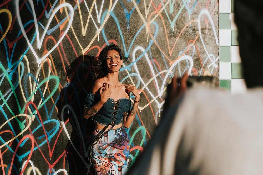 Beautiful model posing by a wall | Premium Photo - rawpixel