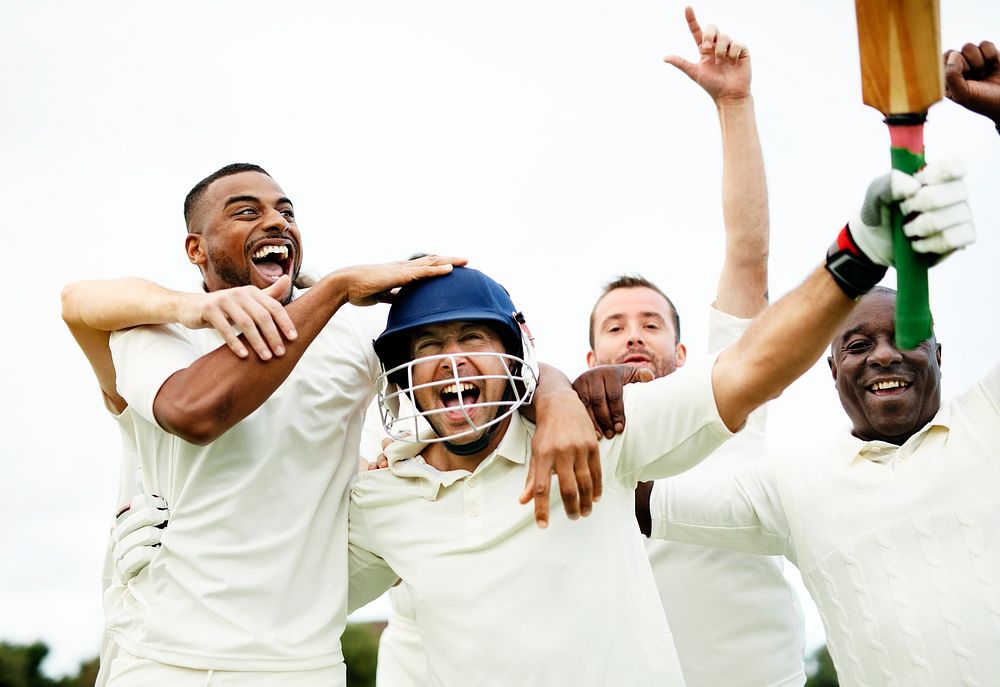 Cheerful cricketers celebrating their victory | Photo - rawpixel