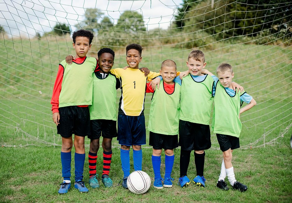 Junior football team standing together | Free Photo - rawpixel