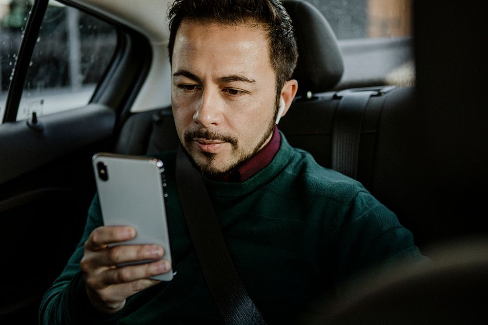 Man using his mobile phone | Free Photo - rawpixel