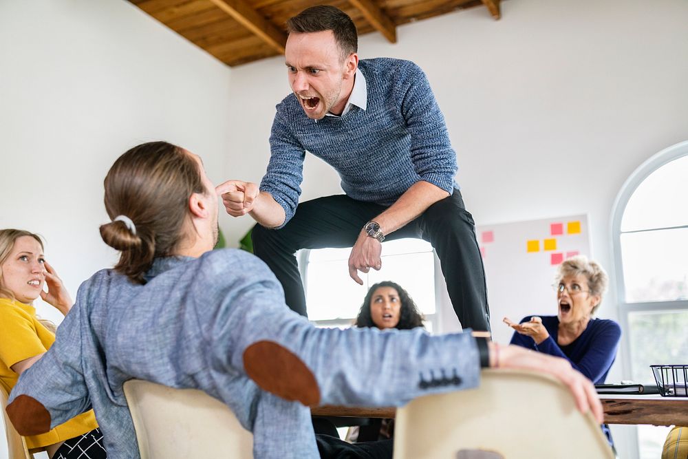 Angry man standing over the table | Premium Photo - rawpixel