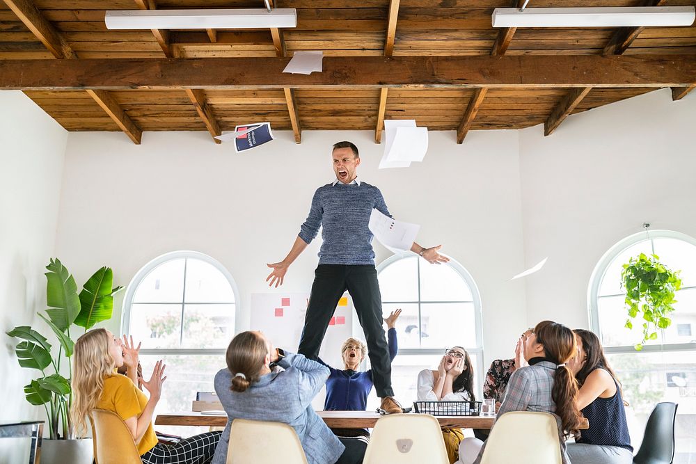 Angry man standing over the table | Premium Photo - rawpixel
