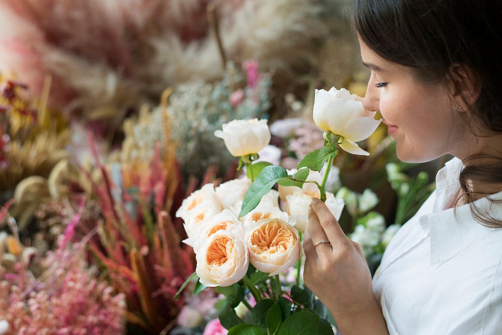 Woman smelling a bouquet of Romantic | Premium Photo - rawpixel
