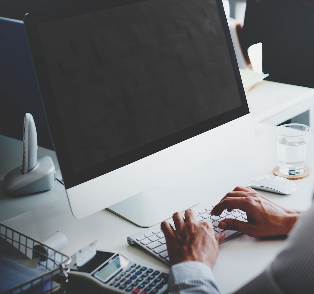 Man using a computer with an | Premium PSD Mockup - rawpixel