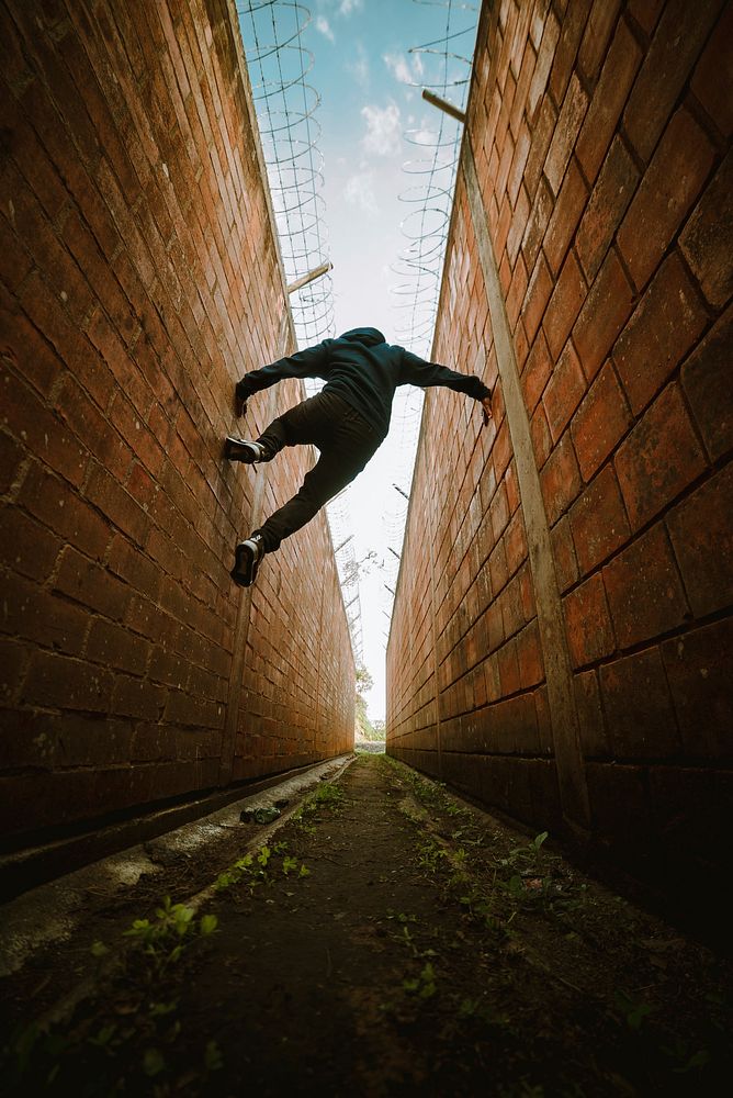 Man jumping between buildings. Free | Free Photo - rawpixel