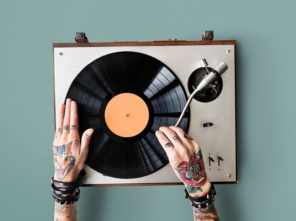 Tattooed hands playing on a vinyl | Premium Photo - rawpixel
