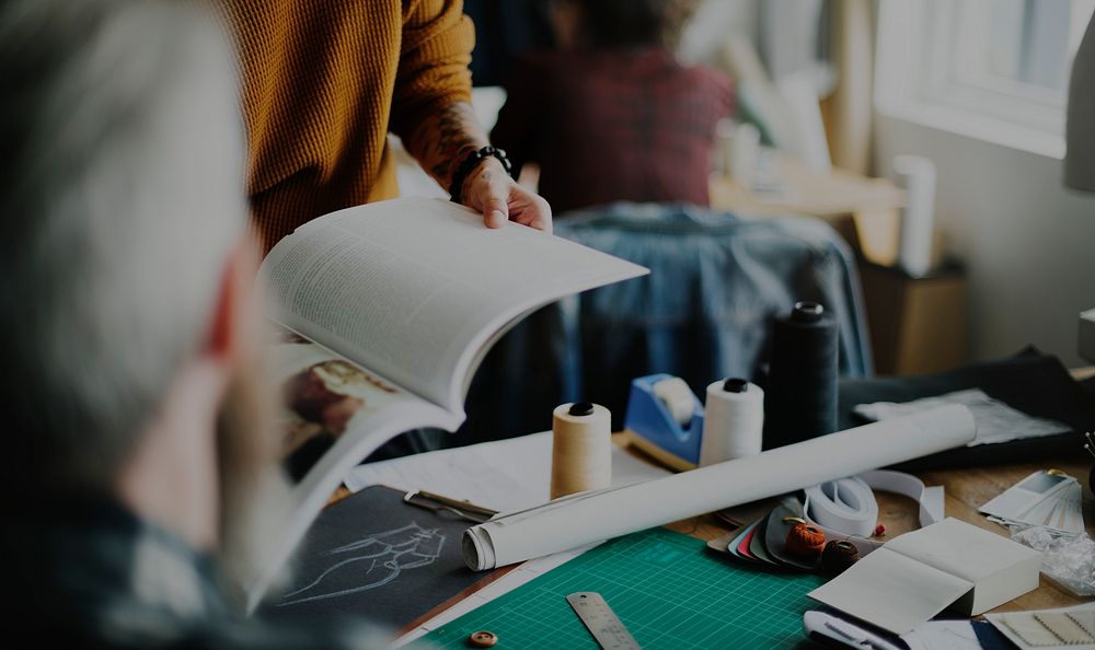 Fashion designer reading a book | Premium Photo - rawpixel