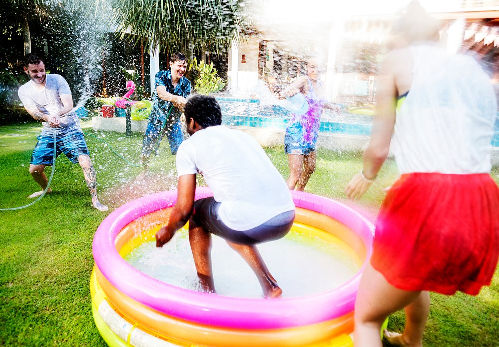 Diverse young adult splashing water | Free Photo - rawpixel