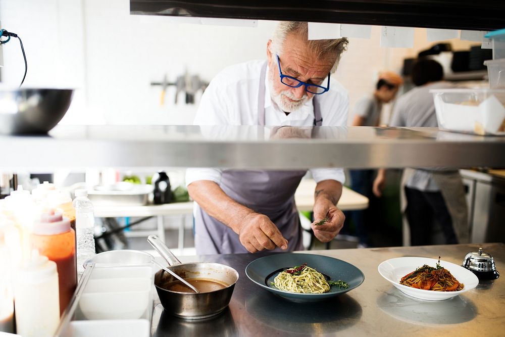 Chef working and cooking in the kitchen | Premium Photo - rawpixel