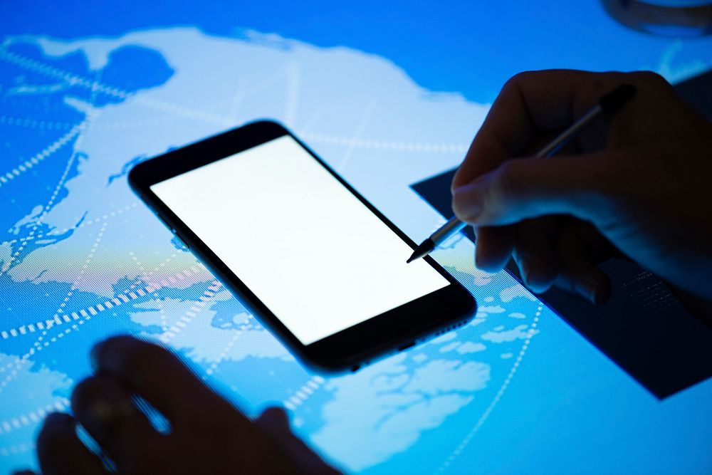 Mobile phone on digital map | Premium PSD Mockup - rawpixel