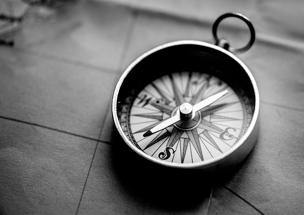 Closeup of compass on the map | Free Photo - rawpixel