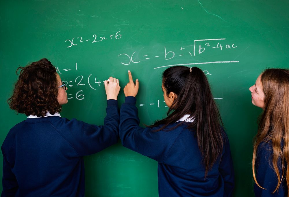 Students solving a math problem | Photo - rawpixel