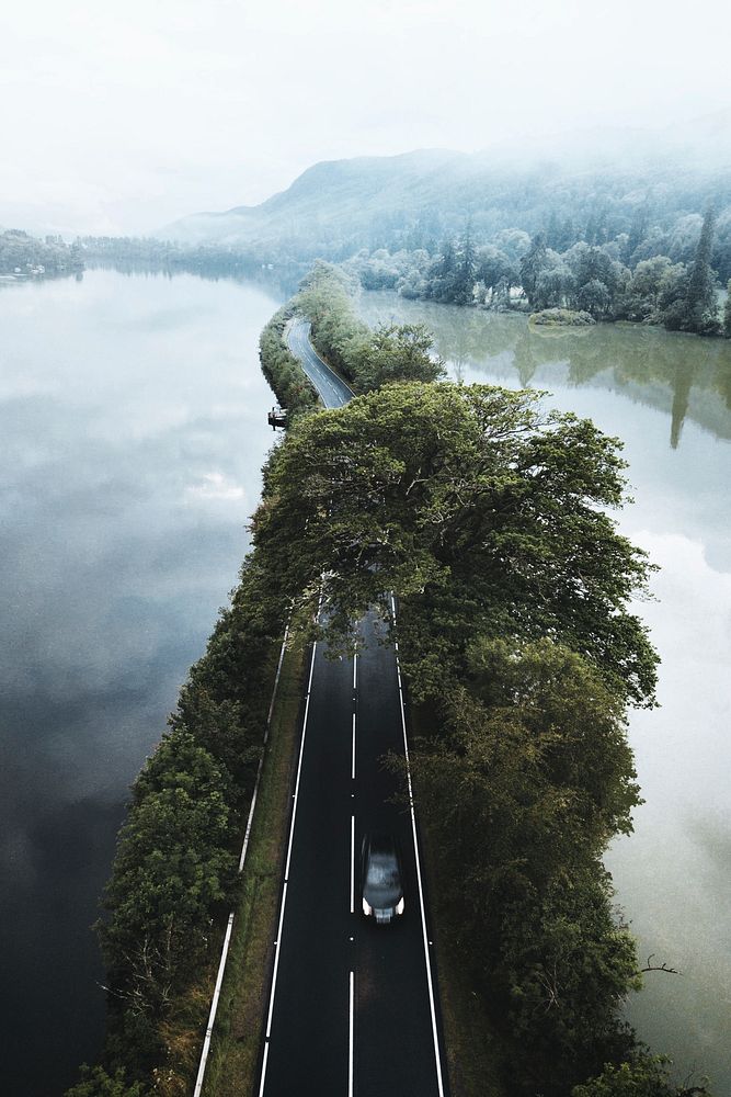 Driving along the road on a lake | Premium Photo - rawpixel