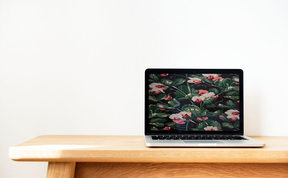 Laptop with flowers wallpaper on a wooden | Premium Photo - rawpixel