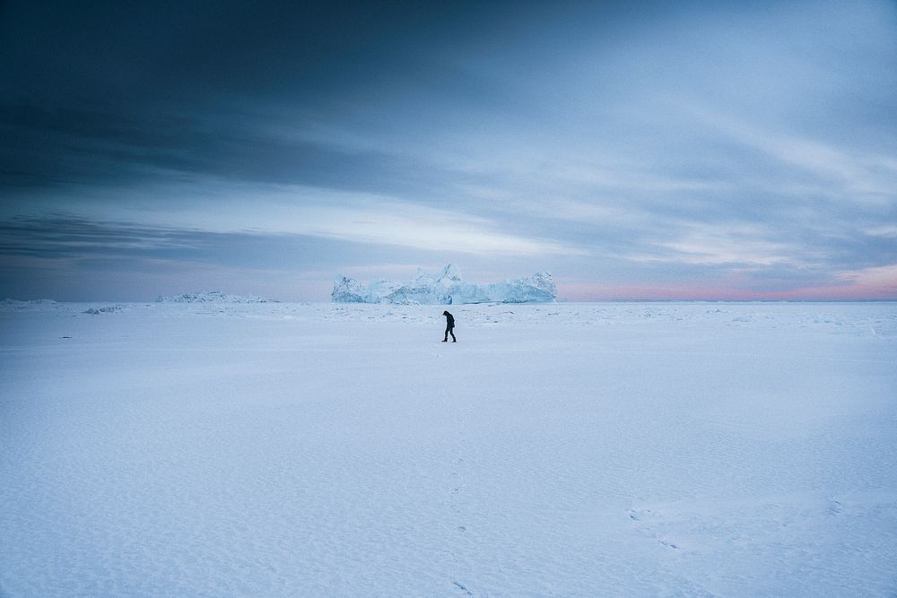 Man walking through the snow | Premium Photo - rawpixel