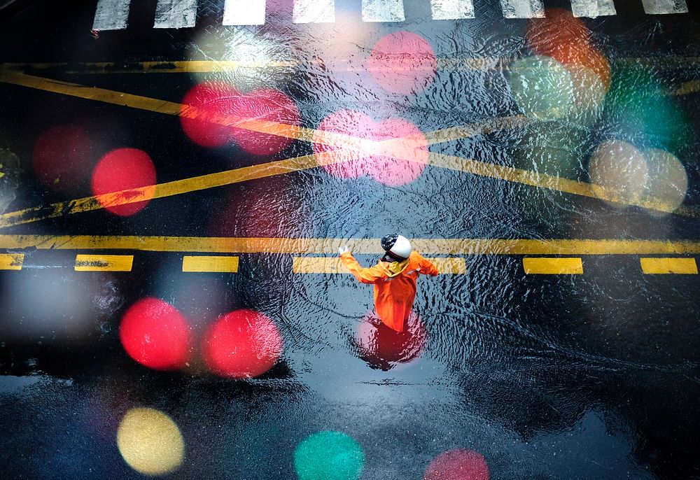 Traffic police standing in the rain | Free Photo - rawpixel