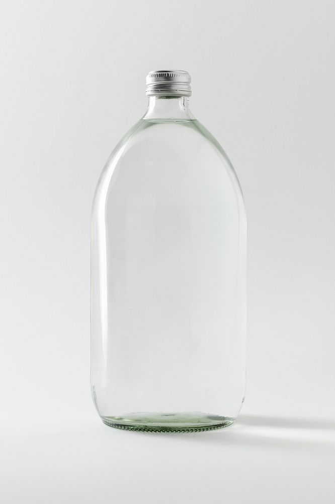 Empty clear glass bottle on off white | Free Photo - rawpixel
