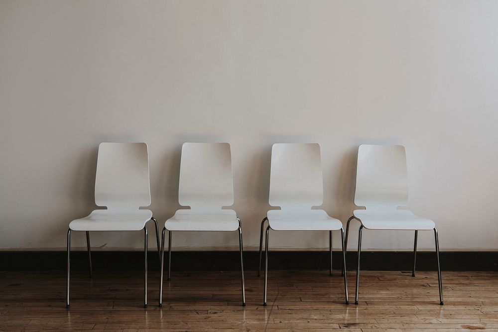 Four empty white chairs in a room | Free Photo - rawpixel
