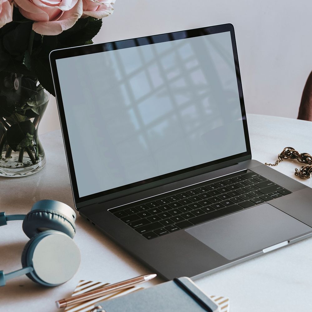 Fresh flowers by a laptop | Free PSD Mockup - rawpixel