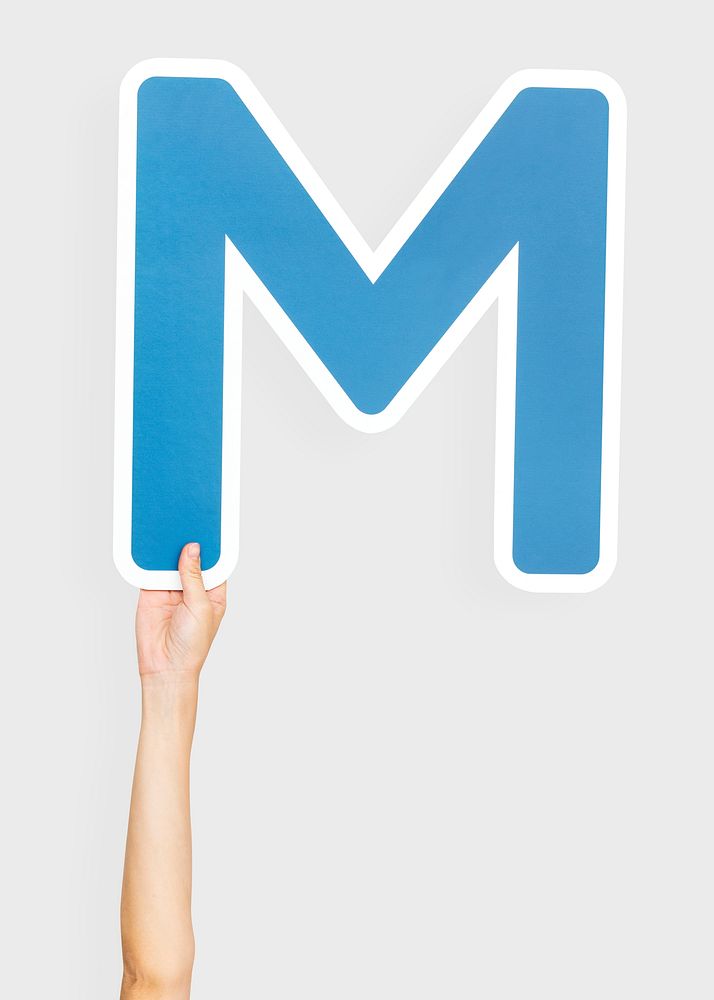 Hand holding the letter M | Premium PSD - rawpixel