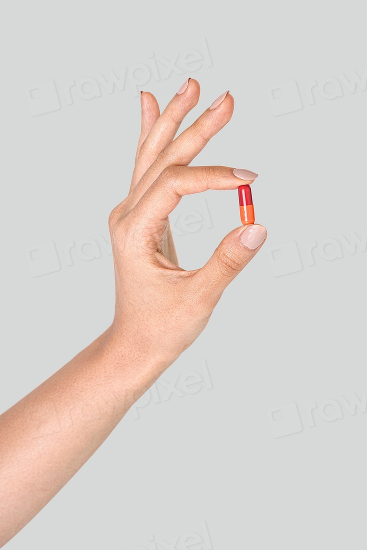 Hand holding a colorful pill | Premium Photo - rawpixel