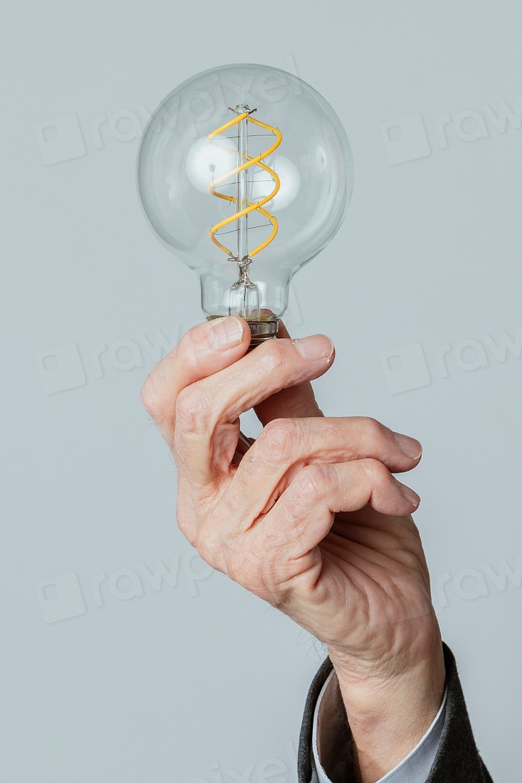Senior man holding light bulb | Premium Photo - rawpixel