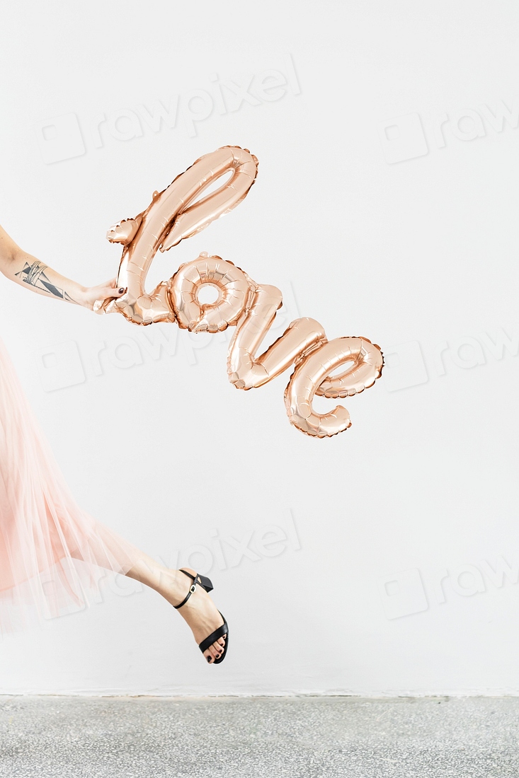Woman holding love foil balloon | Free Photo - rawpixel