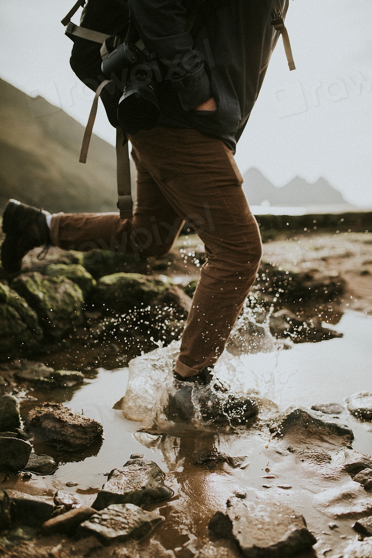 Hiker running through the water | Free Photo - rawpixel