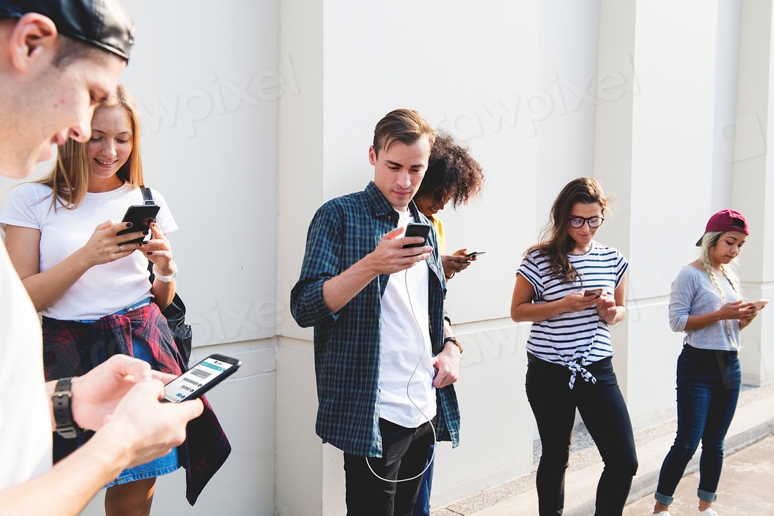 Friends using smartphones outdoors together | Premium Photo - rawpixel