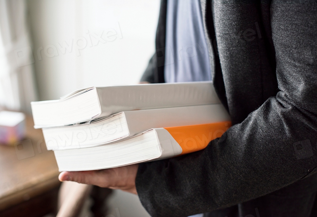 Closeup hands holding stack books | Free Photo - rawpixel