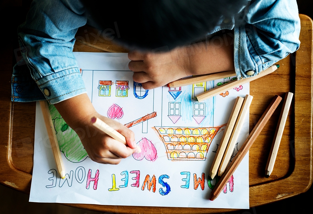 Young boy coloring home sweet | Free Photo - rawpixel