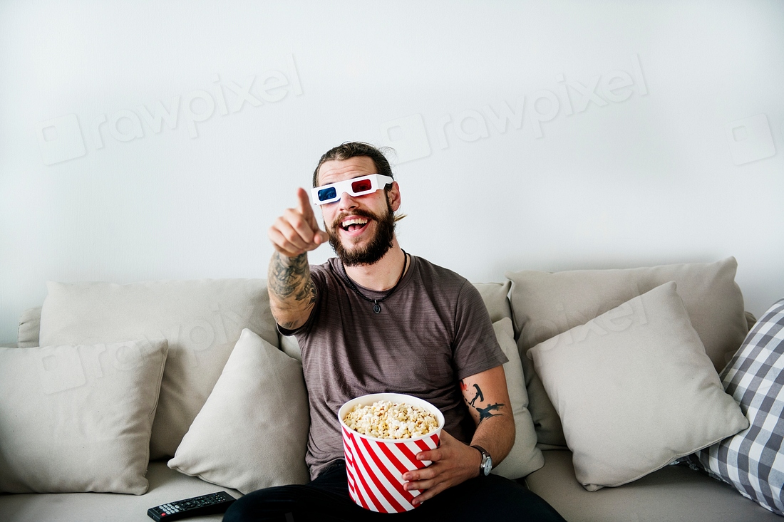 Man watching movie while holding | Premium Photo - rawpixel