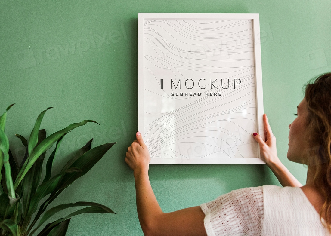 Woman hanging frame mockup wall | Premium PSD Mockup - rawpixel