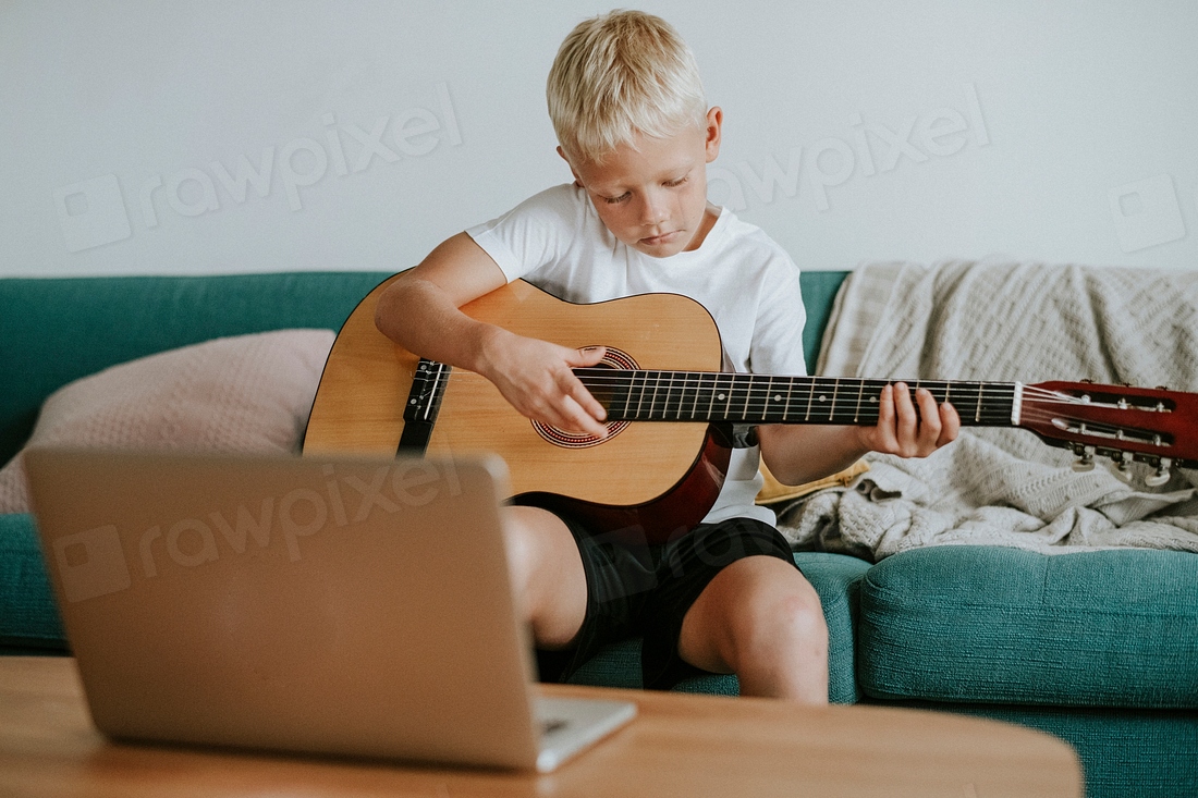 Boy learning play guitar video | Free Photo - rawpixel