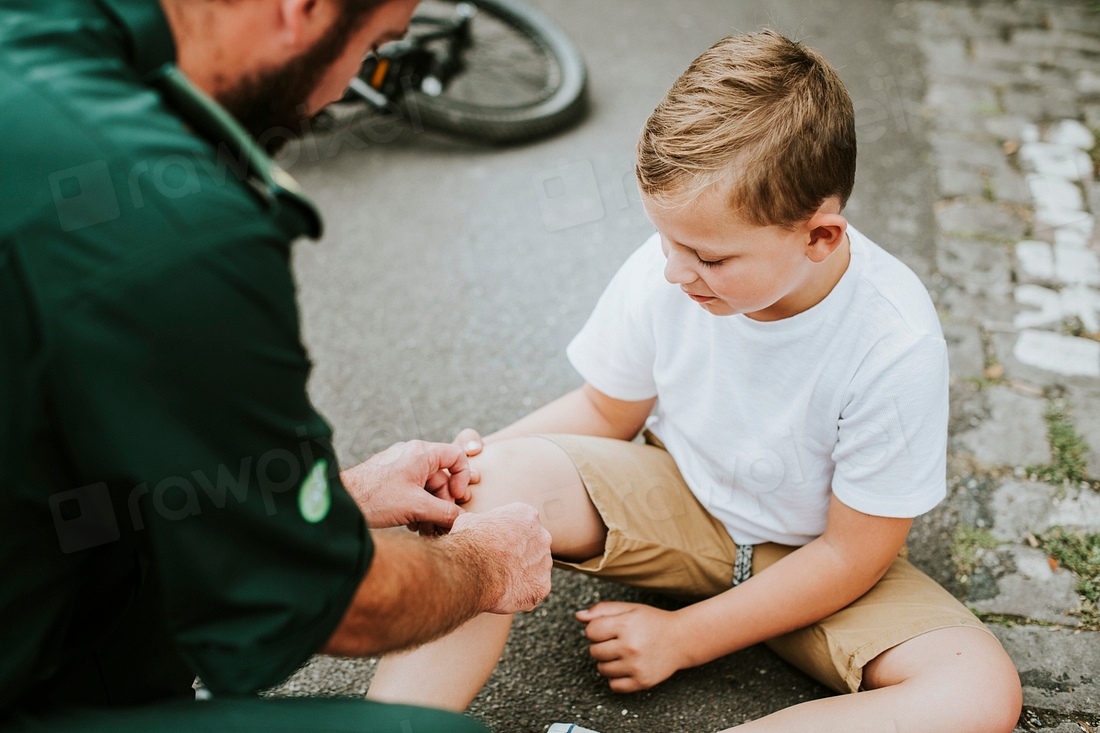 Injured boy getting help paramedics | Premium Photo - rawpixel
