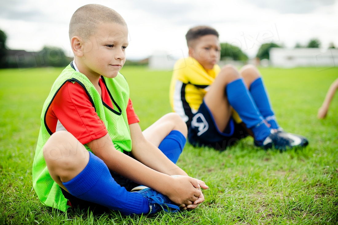 Young football kids stretching field | Free Photo - rawpixel