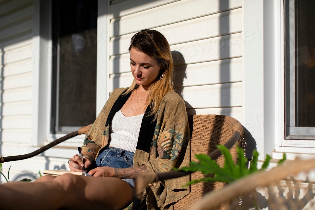 Relaxed woman writing her journal | Premium Photo - rawpixel