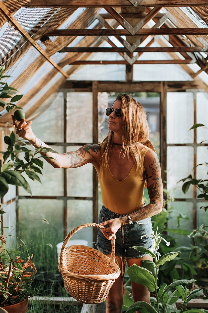 Beautiful woman in a greenhouse | Premium Photo - rawpixel