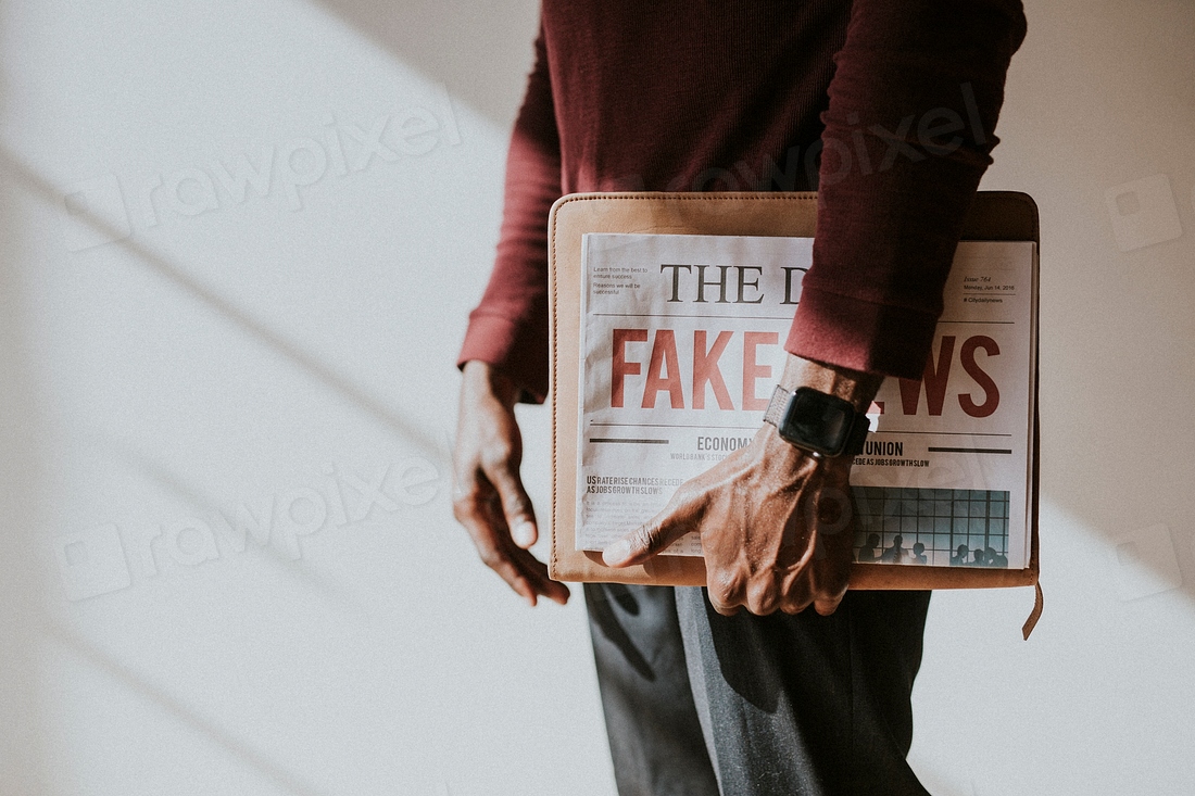 Man holding a newspaper | Premium Photo - rawpixel