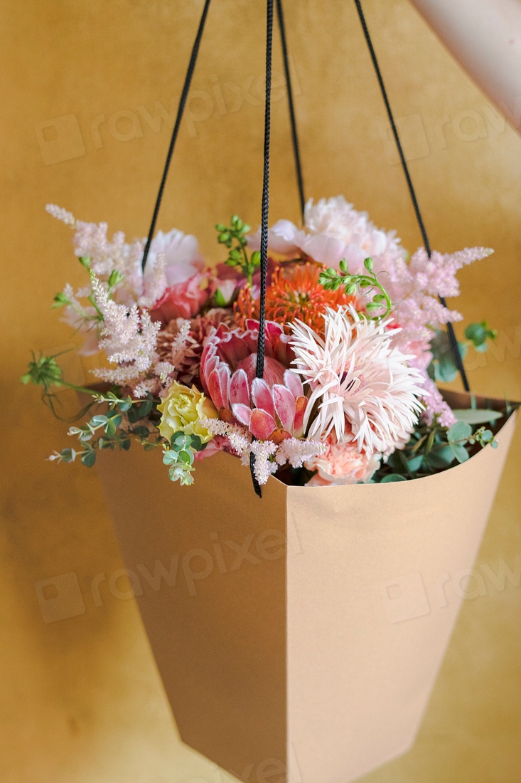 Woman carrying bouquet flowers paper | Premium Photo - rawpixel